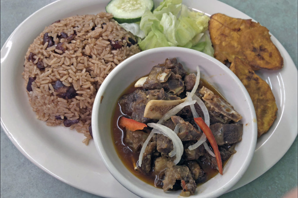 Caribbean Cafe’s cabrit et sauce: stewed goat with Creole seasonings ...