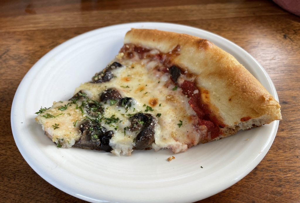 A slice of Hog Father pizza seen in close-up. | LouisvilleHotBytes.com