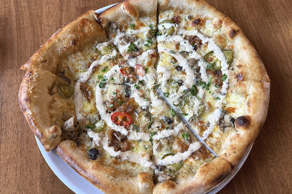 The yummy Mighty Mushroom pizza at Locals brings together a mighty mix ...